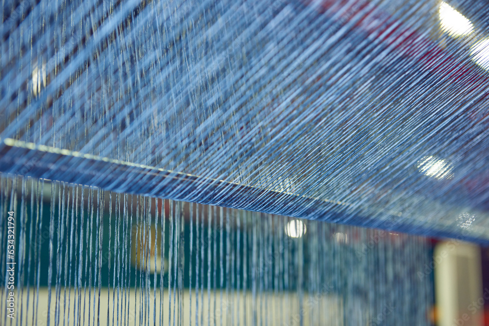 Cotton threads in industrial cotton in a weaving factory, machine ...