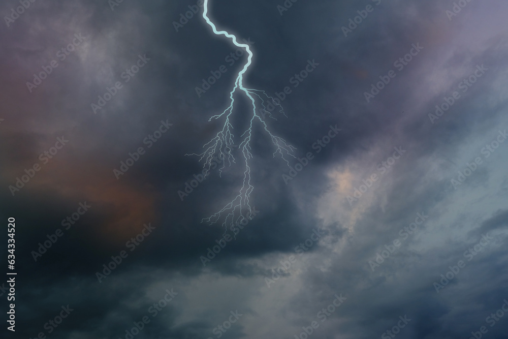 dramatic stormy sky with dark clouds, lightning flashes over the night ...