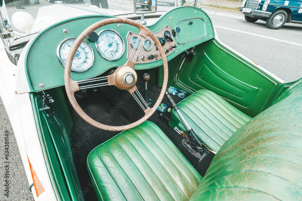 MG TD Midget convertible sports car on city road. MG T-Type is a series ...