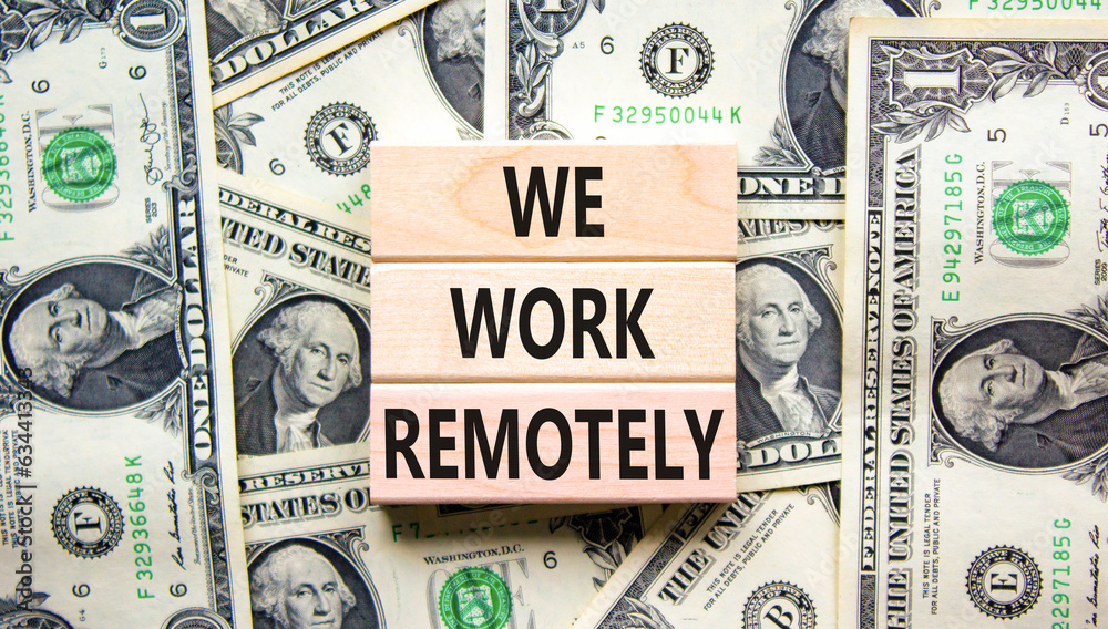 We work remotely symbol. Concept words We work remotely on wooden block ...