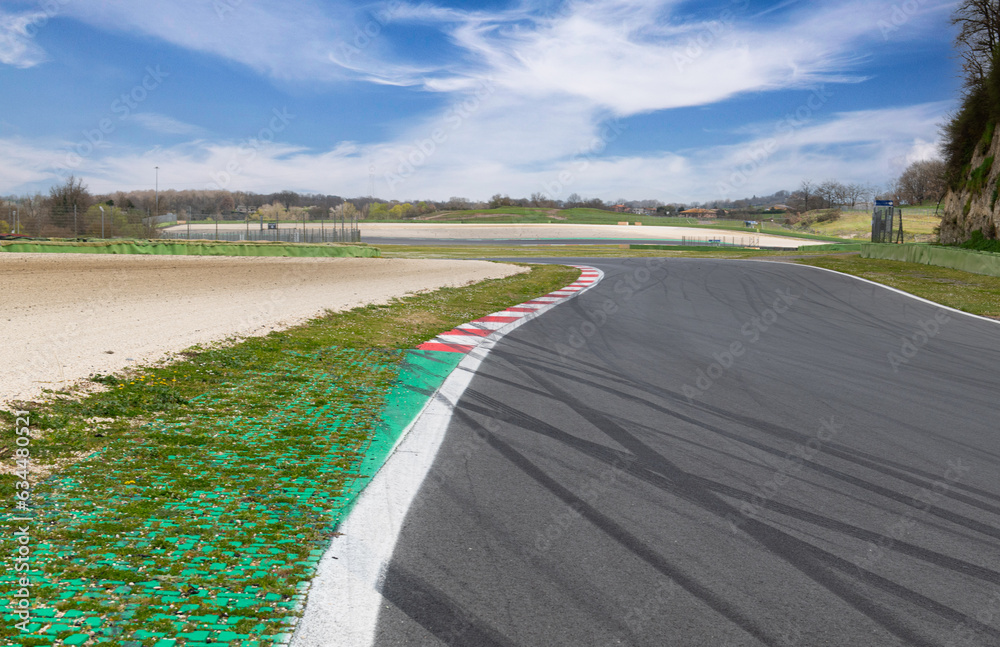 Motor sport asphalt race track and curbs with skid marks, low angle ...