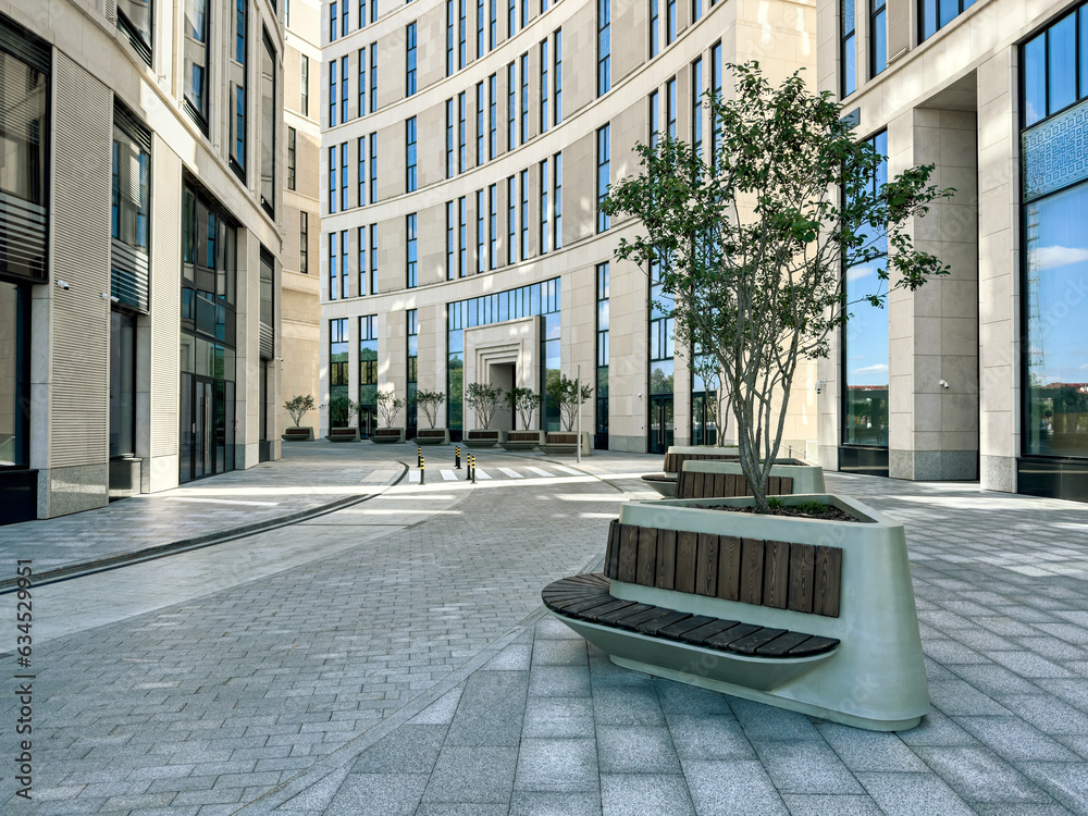 courtyard between glass facades of office buildings. modern ...