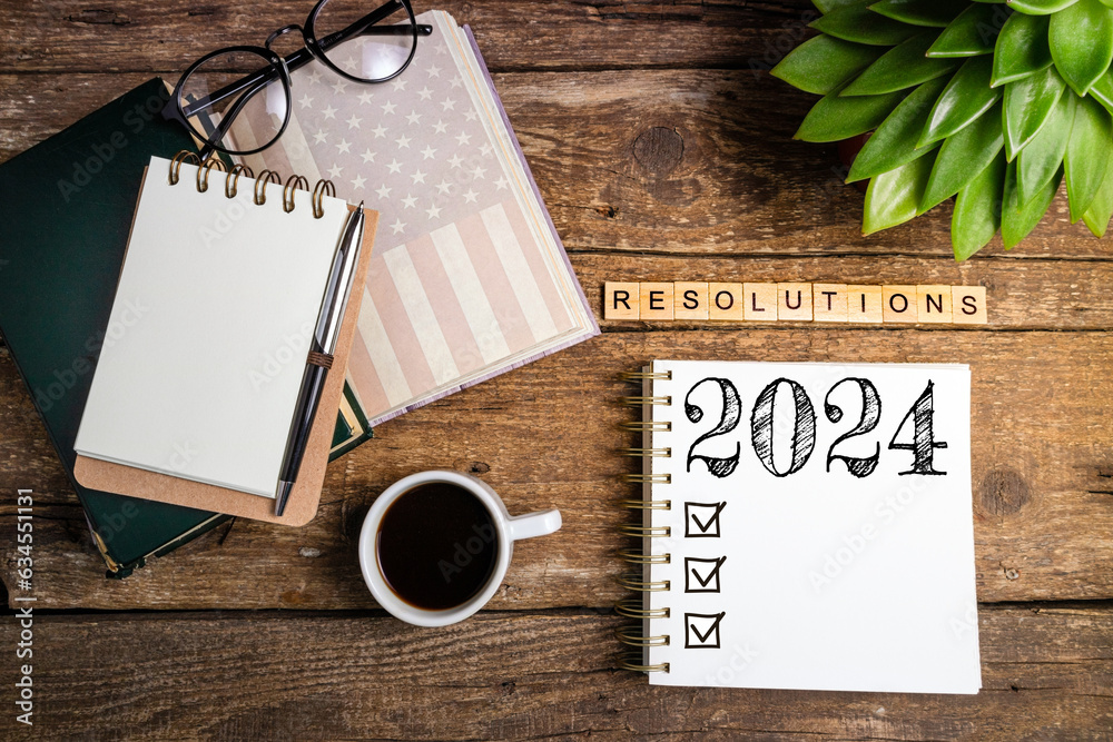 New year resolutions 2024 on desk. 2024 goals list with notebook ...