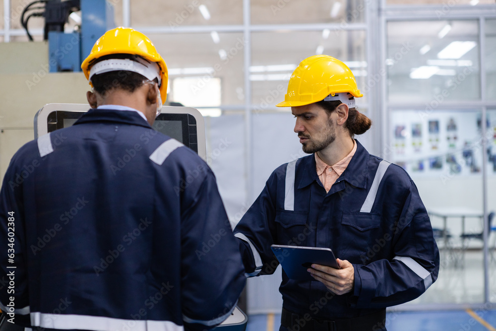 Teamwork engineers wear helmets safety brainstorm at factory workshop ...