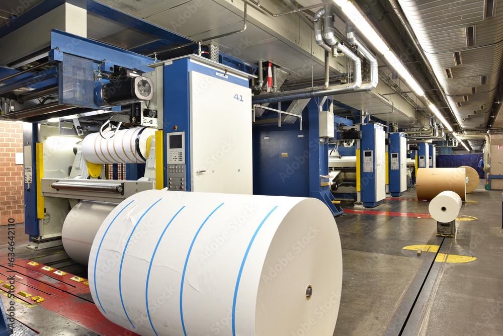 paper rolls and offset printing machines in a large print shop for ...