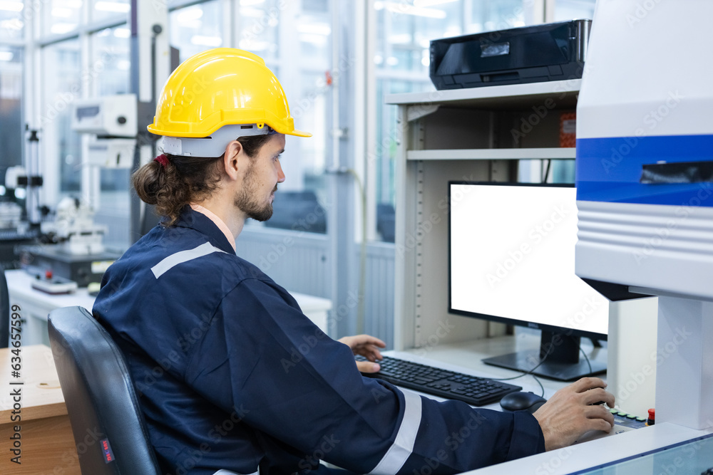 Foto de Man engineer using computer blank white screen controlling cnc ...
