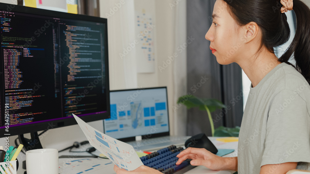 Side view of professional young Asia girl IT development programmer ...