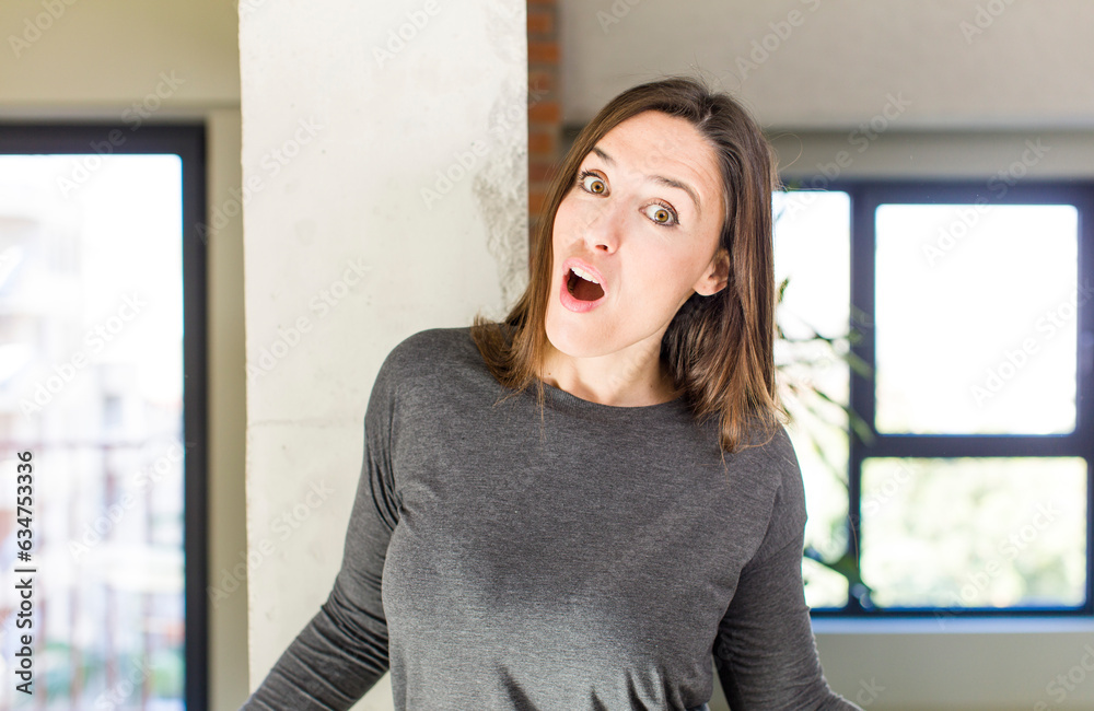 young adult pretty woman feeling clueless and confused, having no idea ...