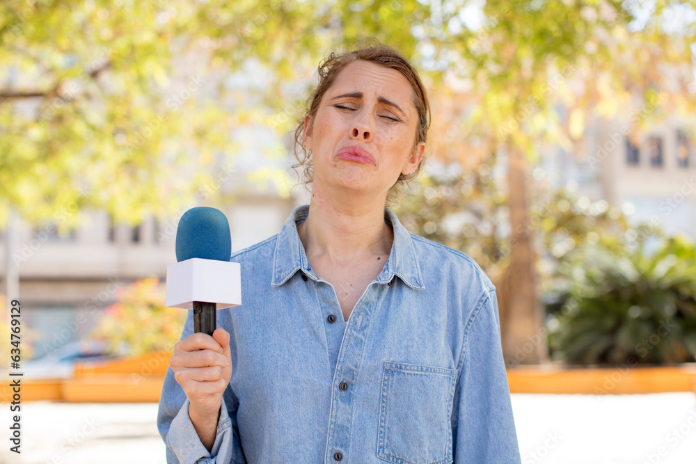 young pretty woman feeling sad and whiney with an unhappy look and ...