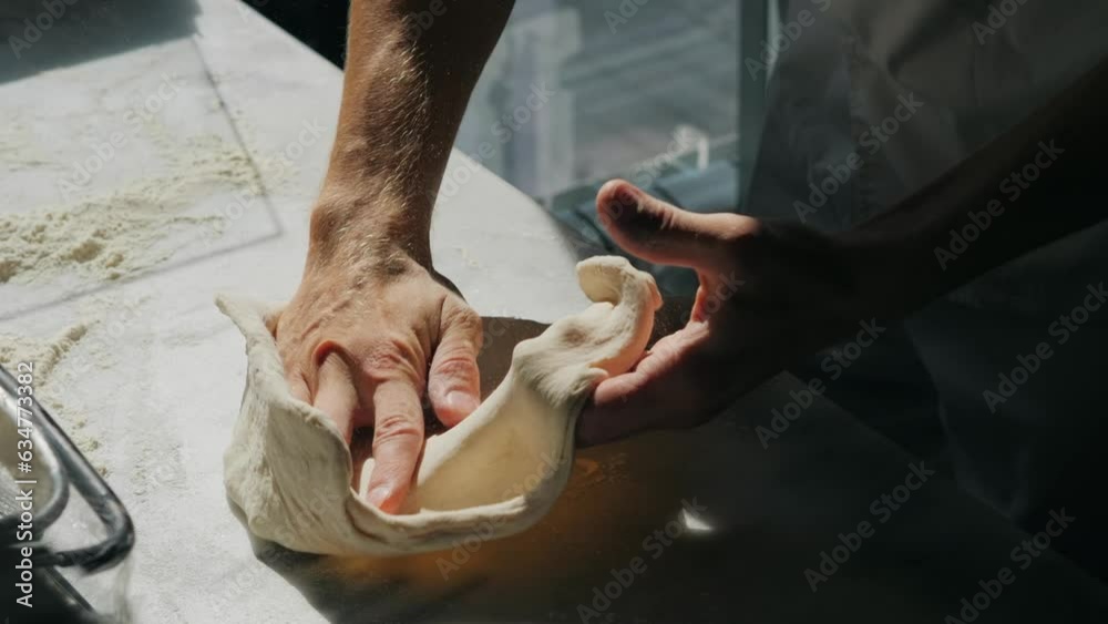 Man cooking pizza, italian cafe, Flying pizza dough with flour ...