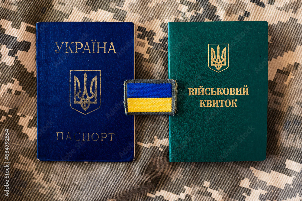 Ukrainian passport and military id identity card with flag of Ukraine ...