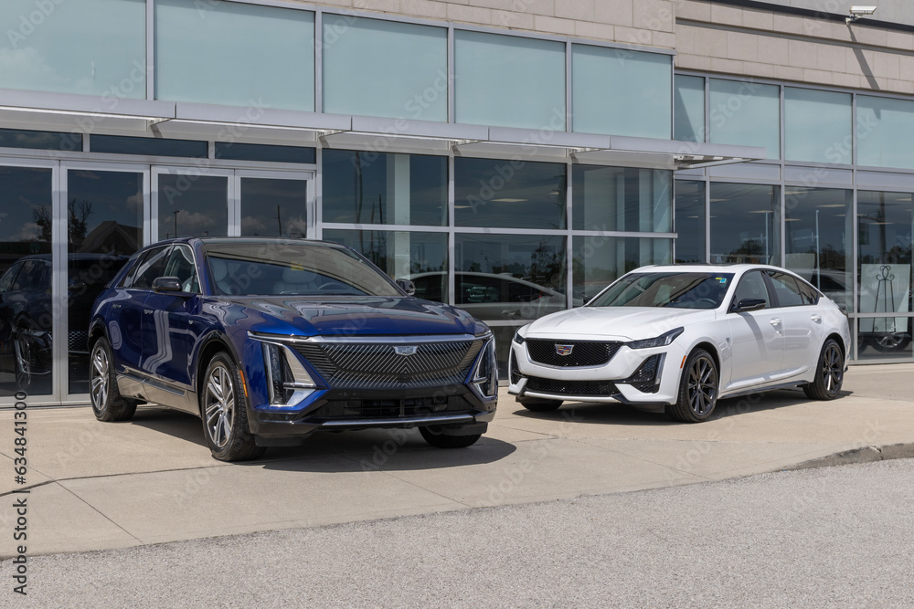 Cadillac LYRIQ and CT5 display at a dealership. Cadillac offers both ...