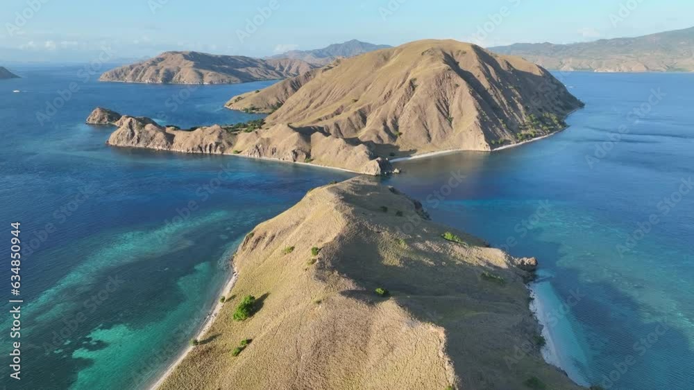 Beautiful coral reefs fringe the scenic island of Gili Lau Laut in ...