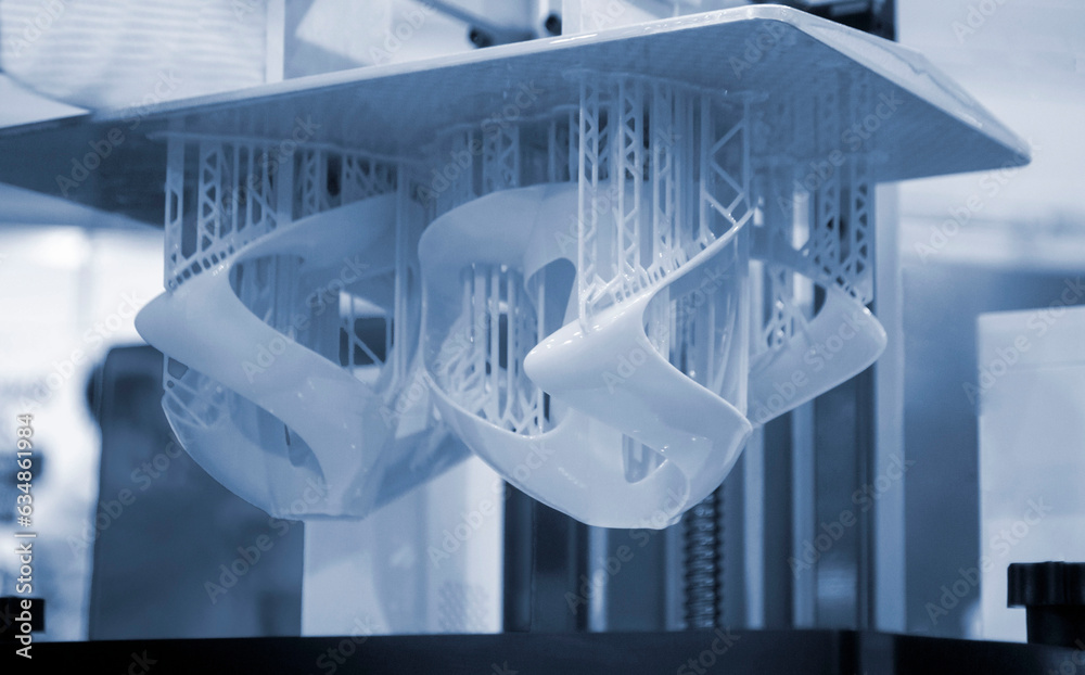 Printed models on 3D printer close-up. Objects printed on photopolymer ...