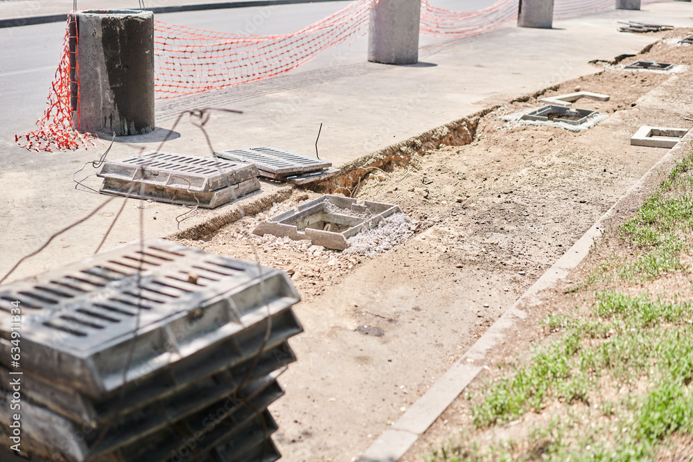 Laying concrete manholes and drain pipes for stormwater system ...