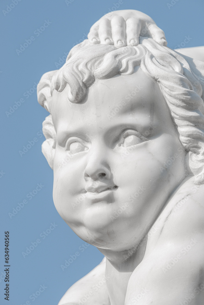 Potsdam, Germany - Old sculpture of young child in the city park and ...