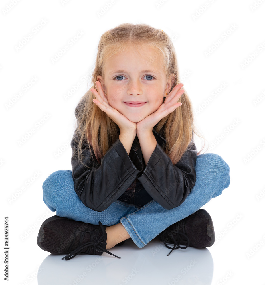 Happy seven years old girl sitting on the floor supported face with her ...