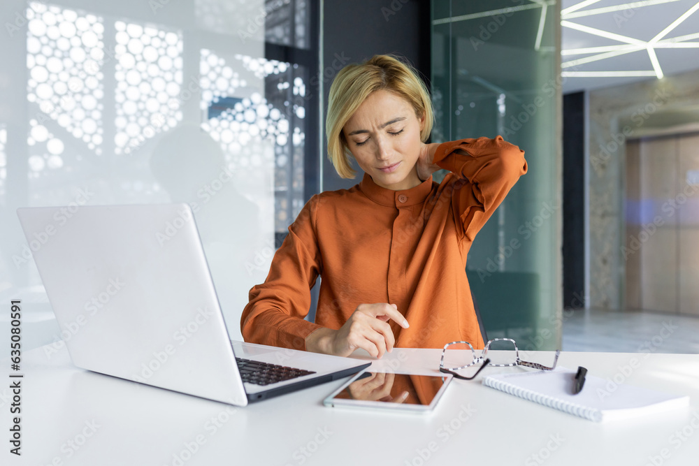 Businesswoman tired at workplace, long sitting work inside office, sick ...