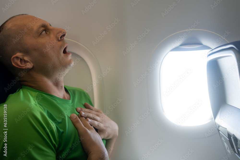 Mature man presses hand to chest has heart attack suffers from ...