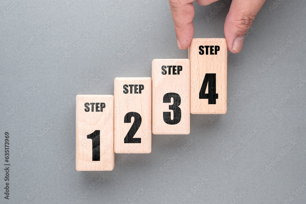 Hand arrange the wood blocks as staircase to show the step method from ...