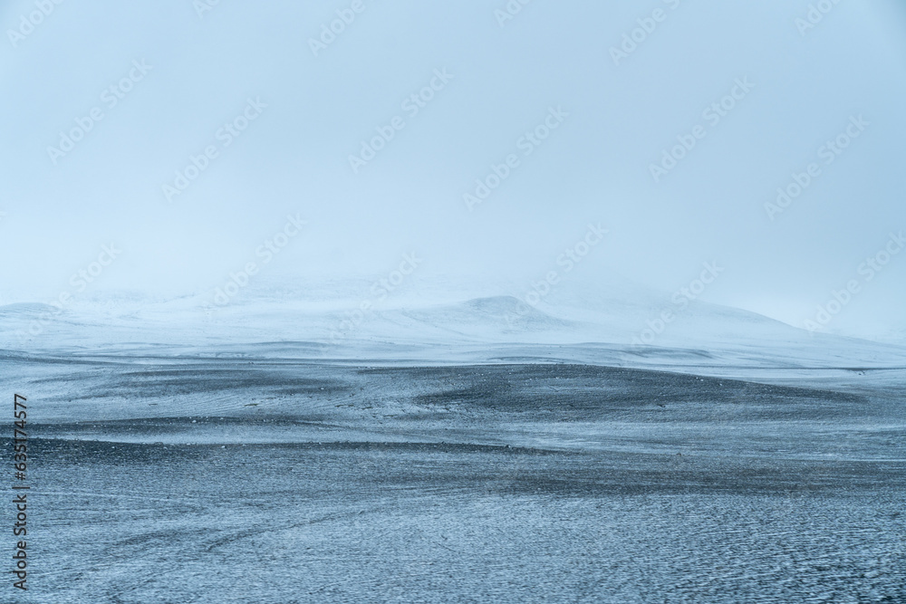 Extremely foggy, cloudy snow storm, during summer, wet slippery road ...