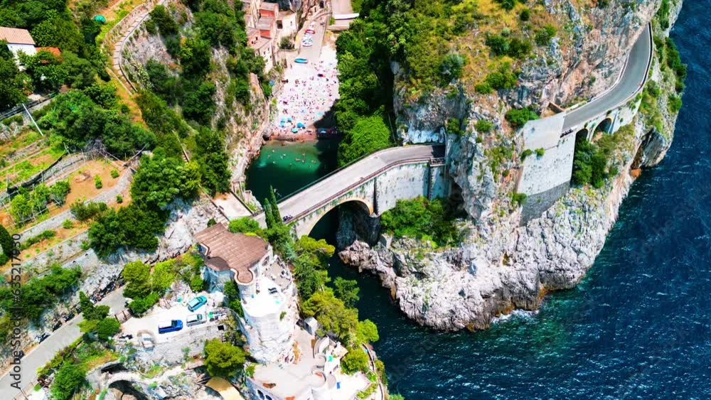 Downward aerial view of Fjord of Furore. Famous bridge and azure water ...