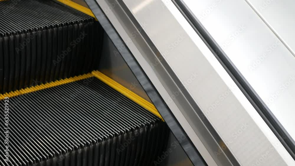 close up view to stair on moving up escalator in subway metro station ...