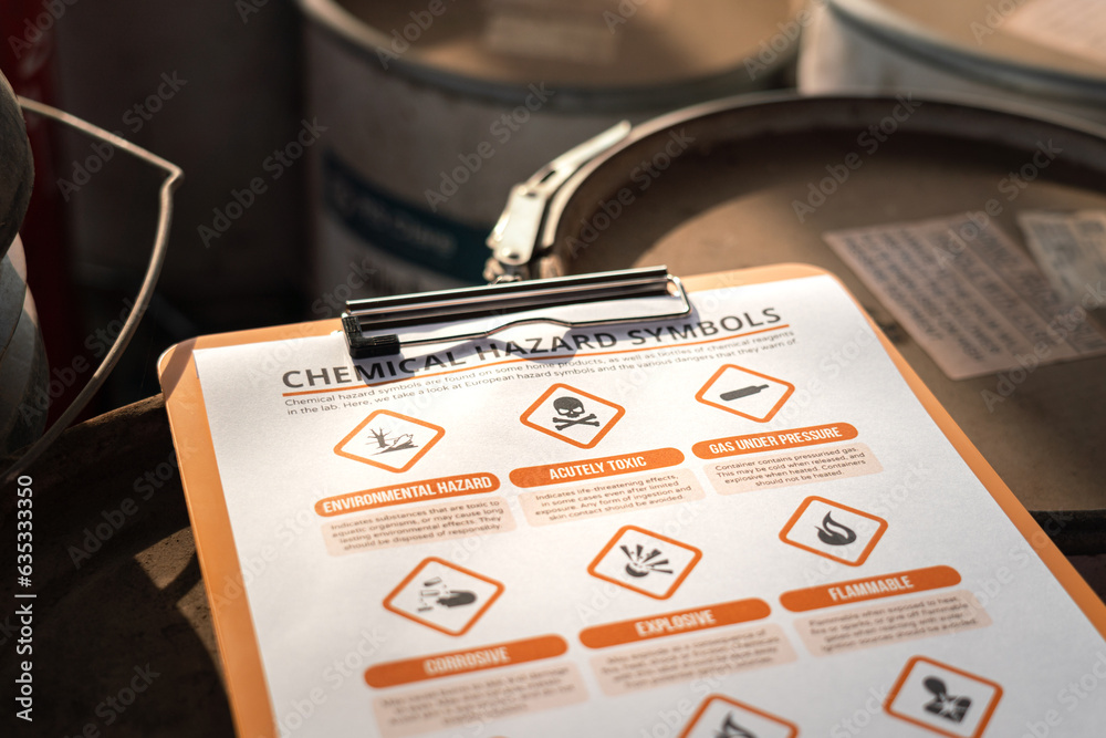 A balloint pen is placed on hazardouse chemical checking icon sysmbol ...