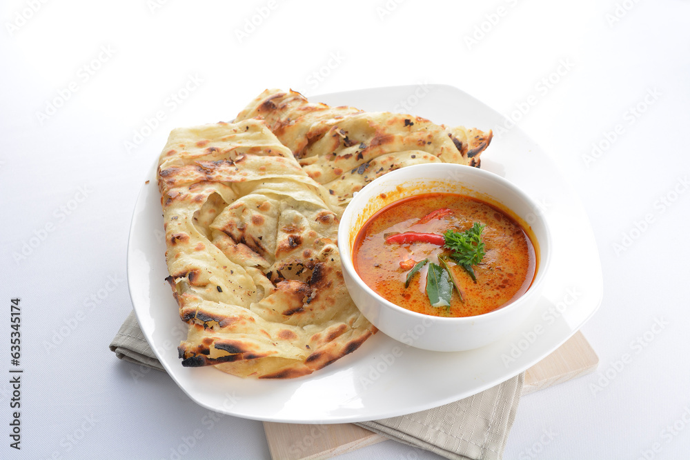 indian baked roti prata canai 2 pieces with spicy chilli curry chicken ...