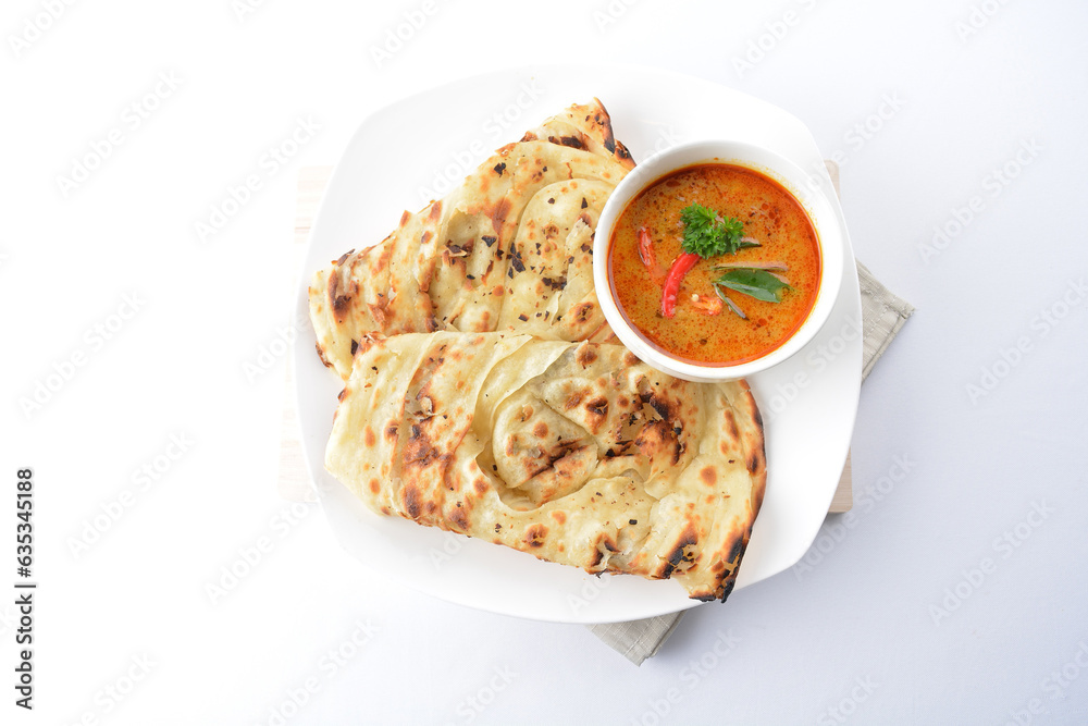 indian baked roti prata canai 2 pieces with spicy chilli curry chicken ...