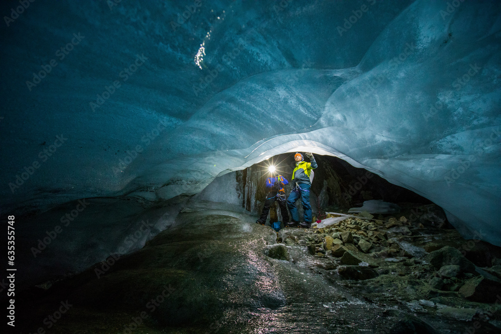 Two Geologists Explore Cave Under Glacier Science And Study Stock