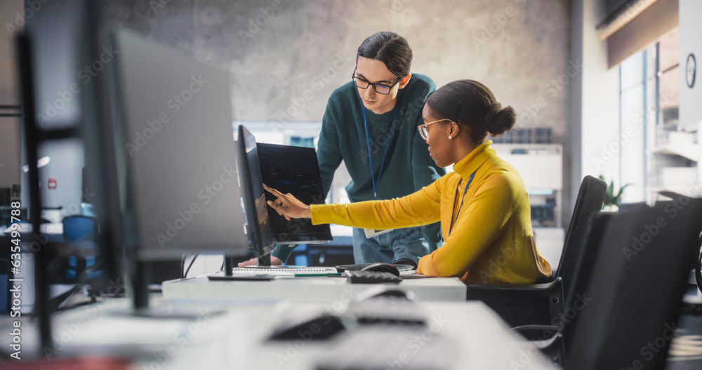 African Female and Caucasian Male Students Working Together in ...