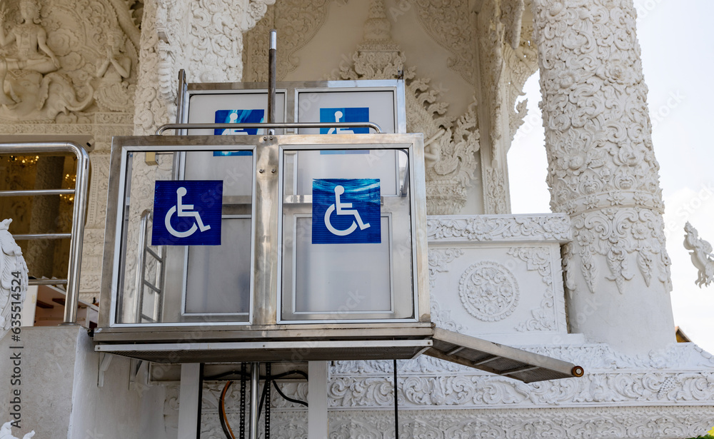 Accessible Elevator with sign. Disabled persons lift near modern ...