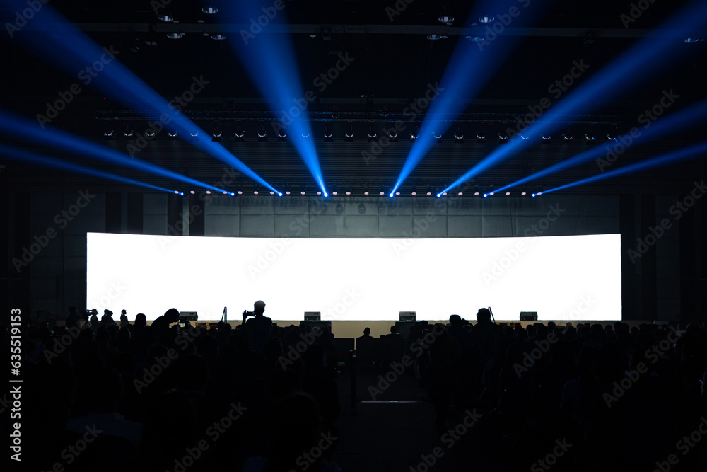 Front view of mockup on big blank white screen with space in huge hall ...