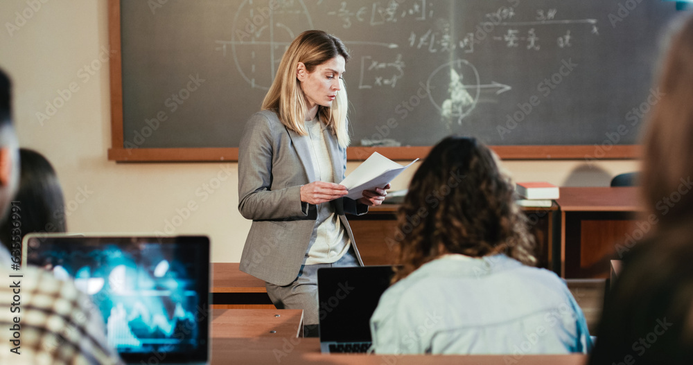 Beautiful Caucasian female professor explaining lection at University ...