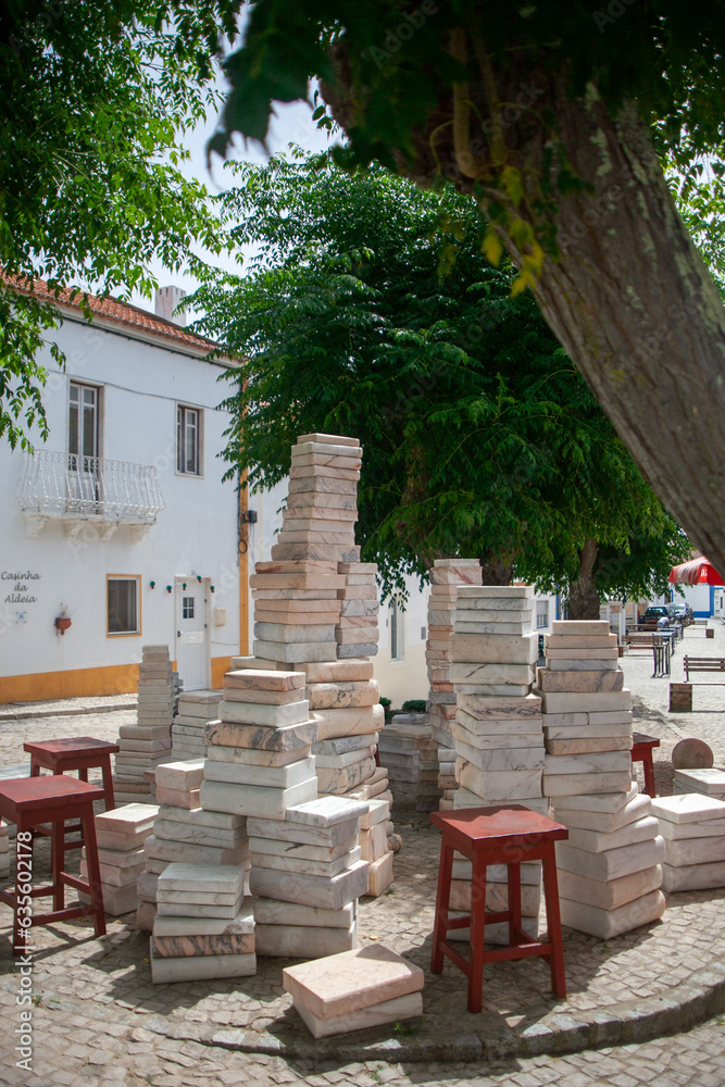Melides, Alentejo, Portugal. June 18 of 2023. Sculpted marble books ...