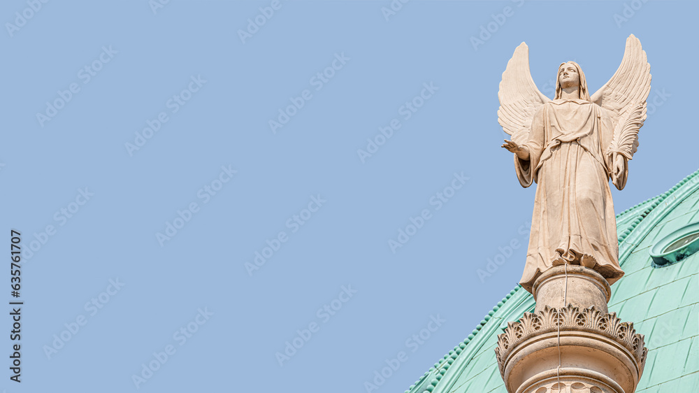 Banner with statue of winged angel at Evangelical church Saint Nikolai ...