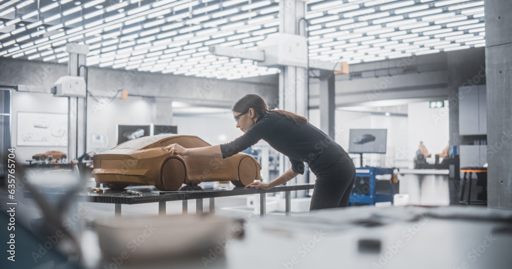 Female Car Modeler Enjoying Creative Work Process on a Concept Car Made ...