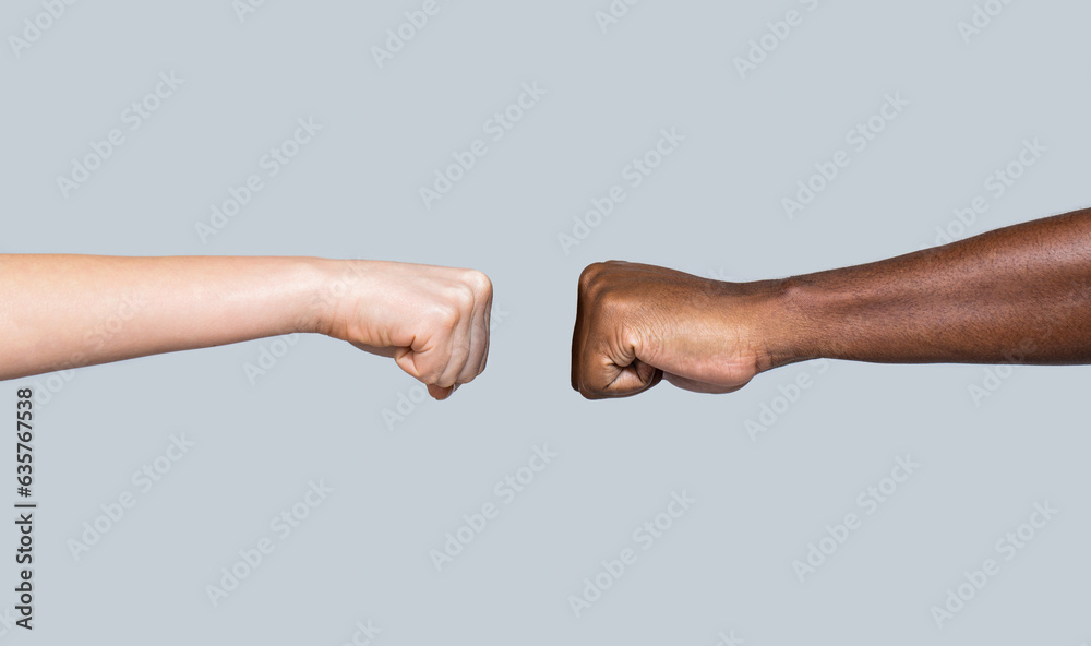 Friendship, team, good work. Multicultural friends giving fist bump to ...