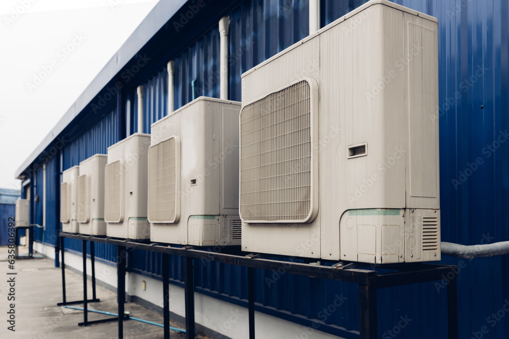 Air conditioner compressor installed in old building. Outdoor split ...