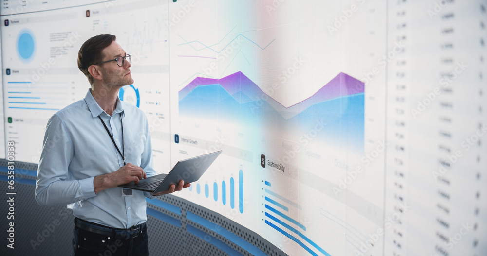 Caucasian Male Business Analyst Holding Laptop Computer And Standing ...