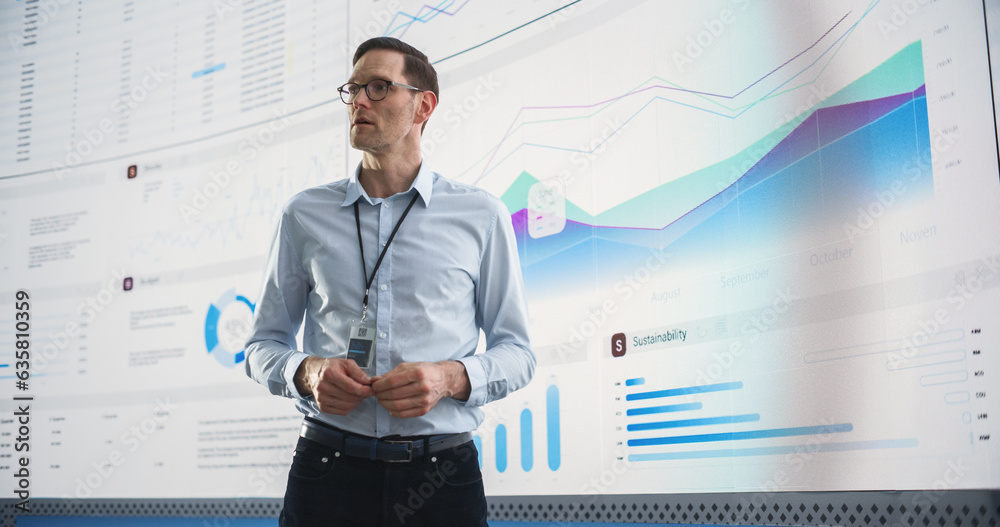 Male CEO Of Data Science Company Is Giving Presentation In Front Of Big ...