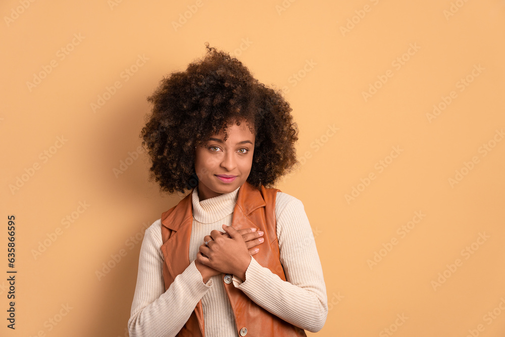 serious brazilian woman hands over heart, chest in all beige colors ...