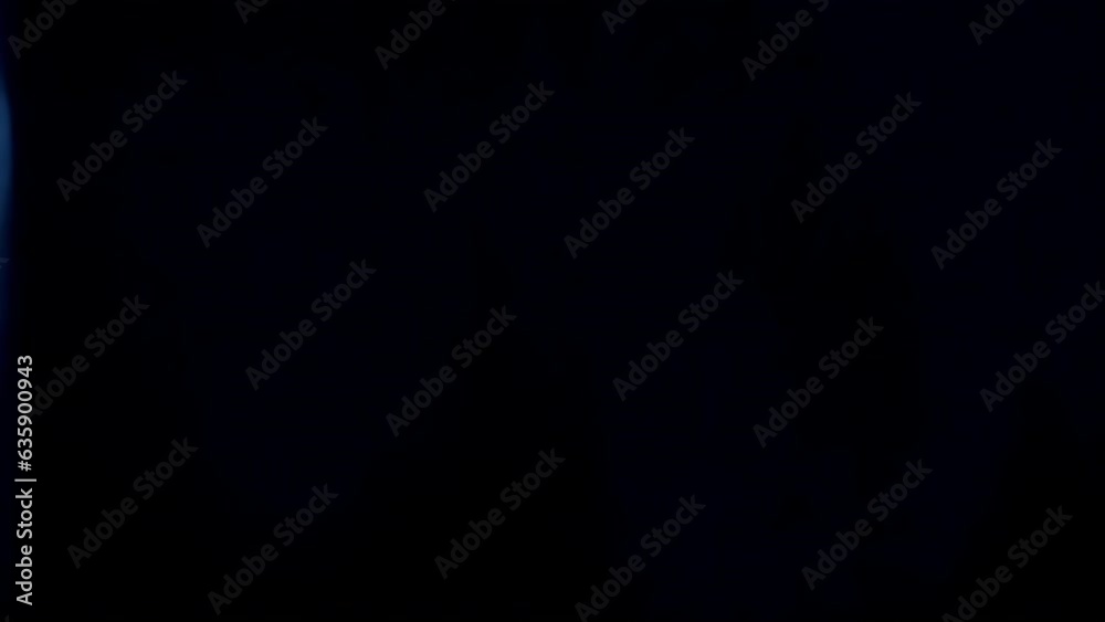 Real optical lens flare from blinking side light with blue bokeh ...