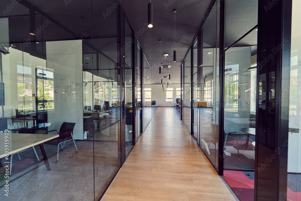 In a setting of modern, glass-walled business startup offices, the open ...