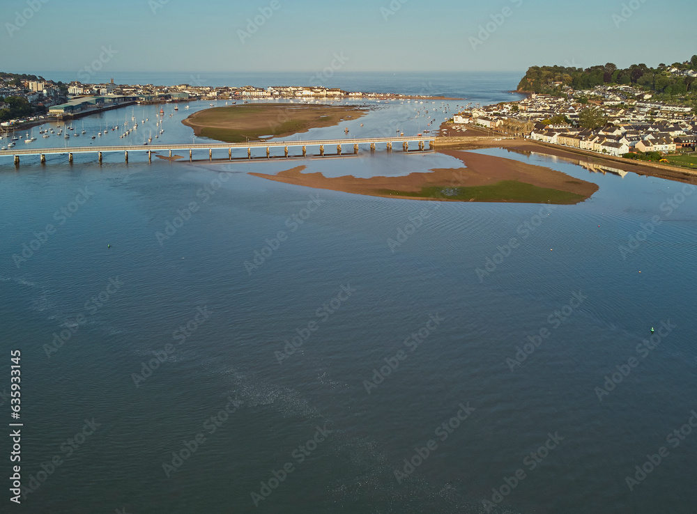 An evening view of the harbour and mouth of the River Teign, plus ...
