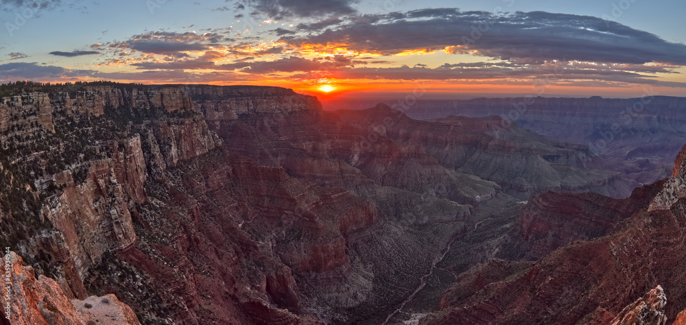 The sun rising at Grand Canyon North Rim, viewed from the Angels Window ...