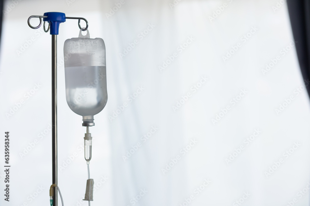 An iron stand to hang saline bottle high to deliver saline via catheter ...