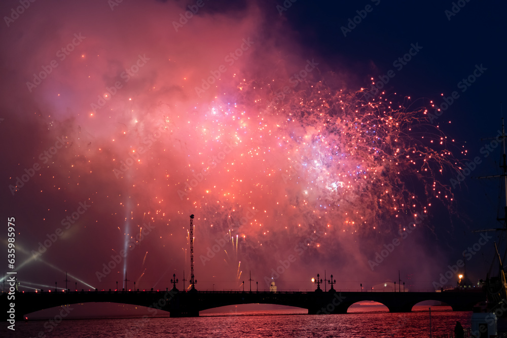 Beautiful red firework explodes in night city sky above bridge ...