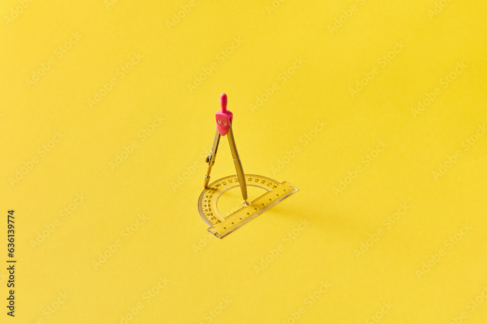 Pink compass and protractor on bright yellow background. Stock Photo ...